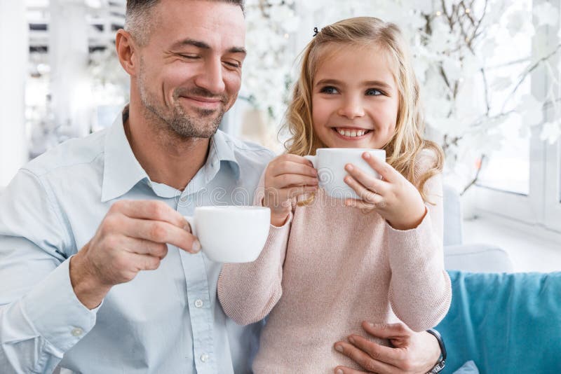Young Father and Daughter Drinking Tea Stock Photo - Image of parent ...