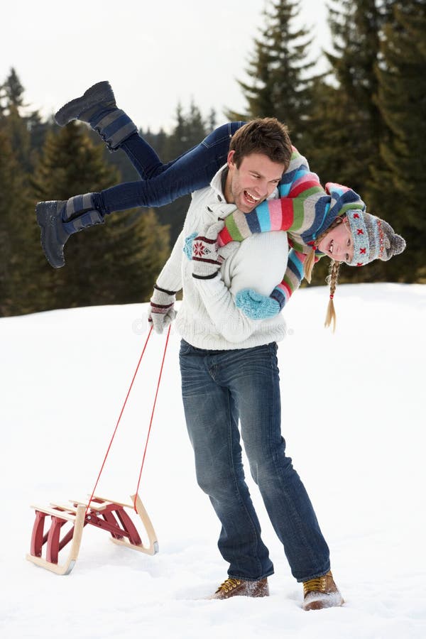 Young Man with Sled in Alpine Snow Scene Stock Photo - Image of smiling ...