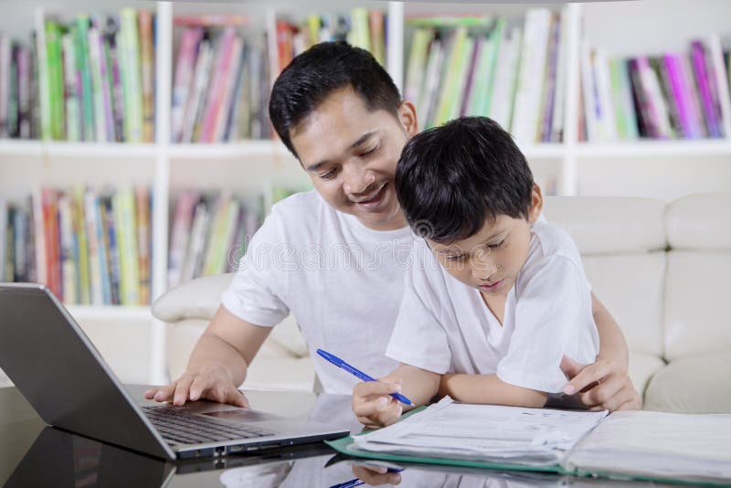Young Father Helps His Son To Study in the Library Stock Photo - Image ...
