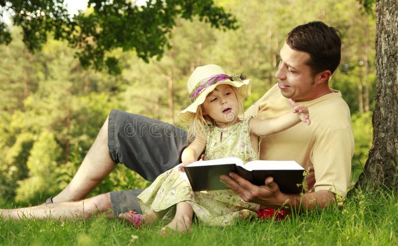 Young Father with His Little Daughter Reads the Bible Stock Image ...