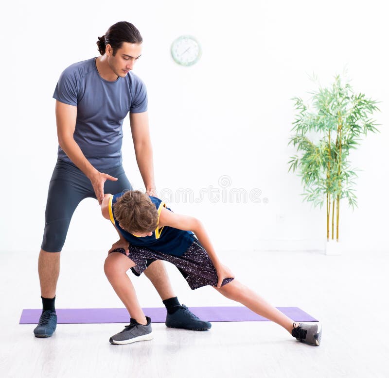 Young Father and His Son Doing Exercises Stock Image - Image of coach ...