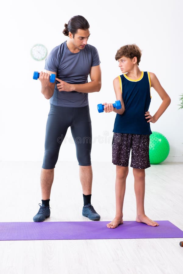 Young Father and His Son Doing Exercises Stock Photo - Image of ...
