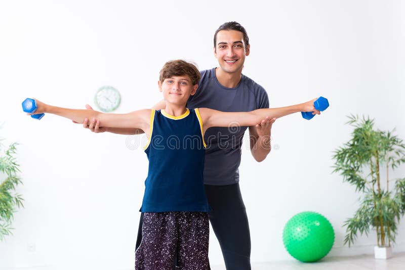 Young Father and His Son Doing Exercises Stock Photo - Image of lifting ...