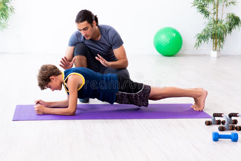 Young Father and His Son Doing Exercises Stock Photo - Image of ...