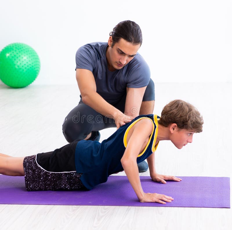 Young Father and His Son Doing Exercises Stock Image - Image of body ...
