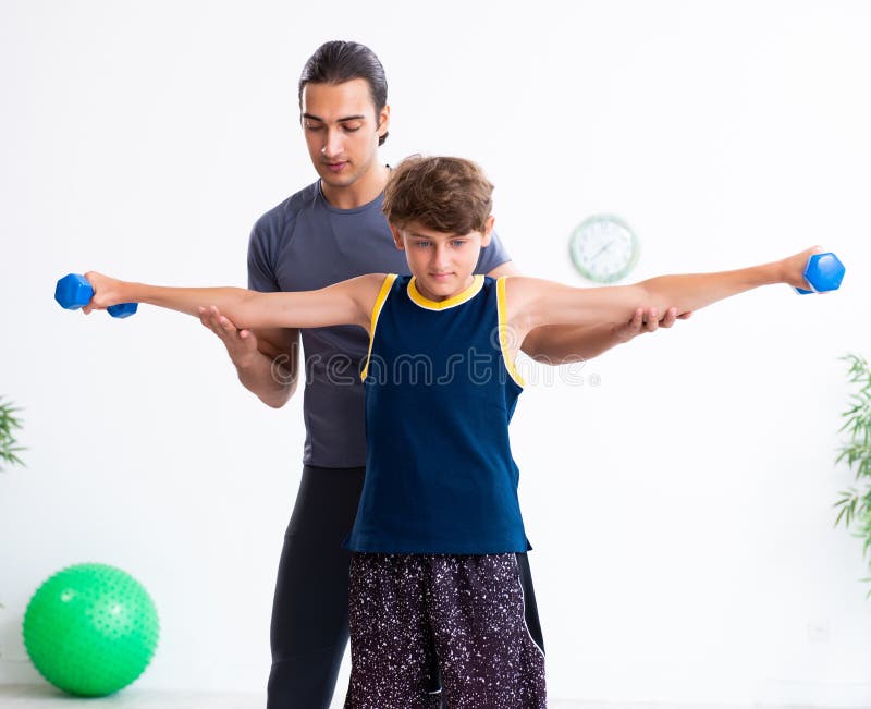 Young Father and His Son Doing Exercises Stock Image - Image of bells ...