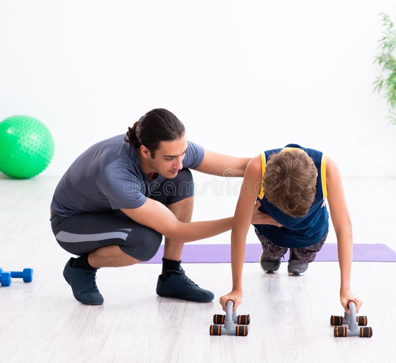 Young Father and His Son Doing Exercises Stock Photo - Image of ...