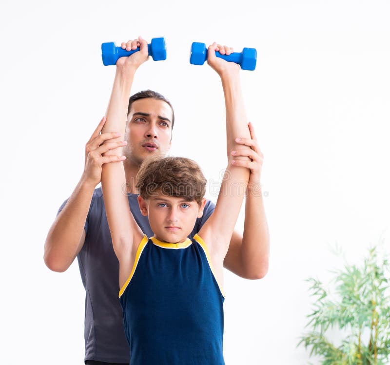 Young Father and His Son Doing Exercises Stock Photo - Image of ...