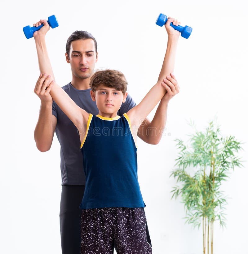 Young Father and His Son Doing Exercises Stock Photo - Image of ...