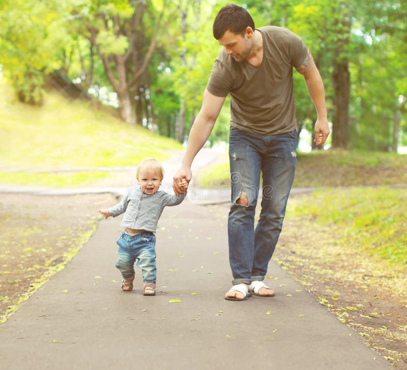 Young Father and Son Walking in Summer Park Stock Photo - Image of ...