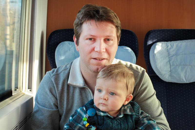 Young Father and Toddler Boy Sitting in Train Stock Photo - Image of ...