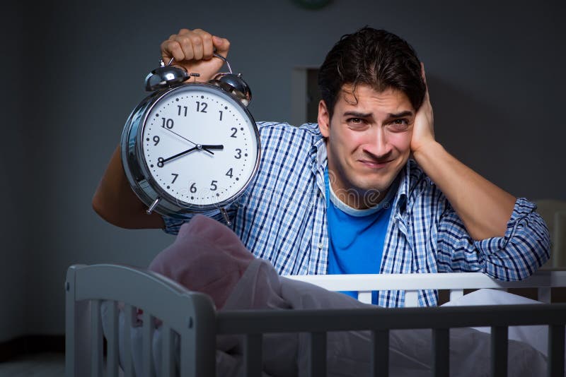 The Young Father Under Stress Due To Baby Crying at Night Stock Photo ...