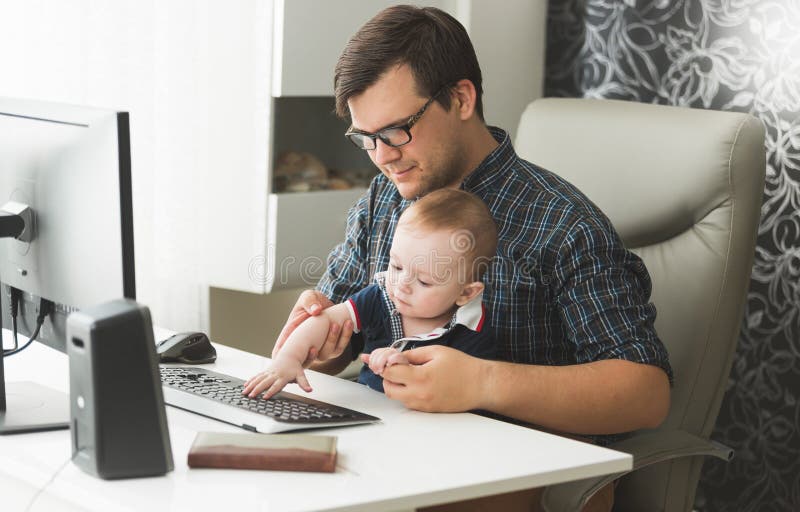 Young Father Working at Home with His Baby Boy Stock Image - Image of ...