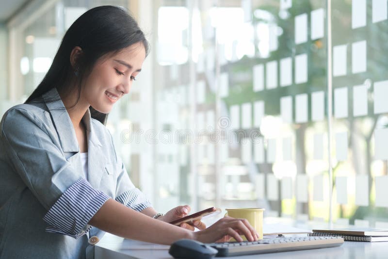 A Young Female Administrative Assistant Making Notes of Working ...