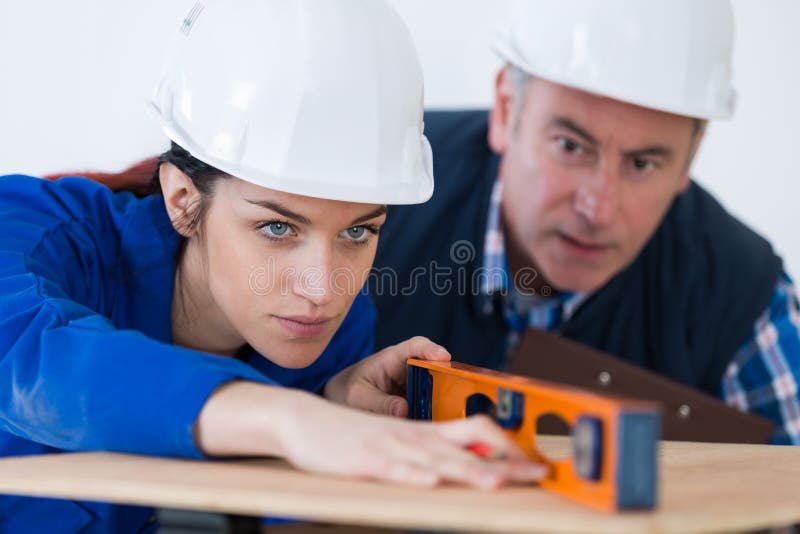 Young Female Apprentice Wit Level Stock Photo - Image of frame, smiling ...