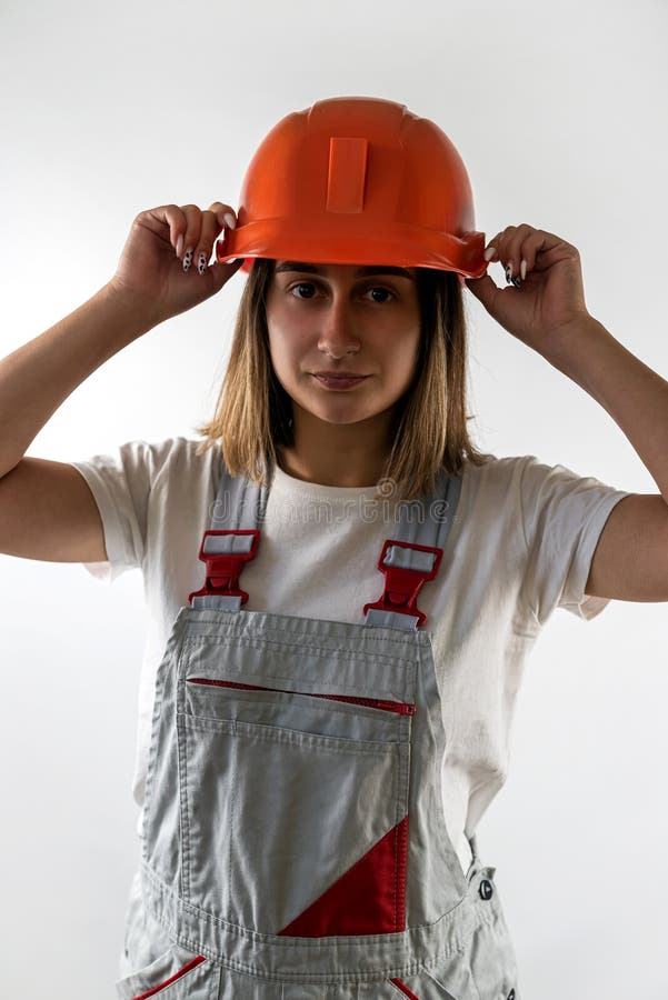 Young Female Architect Builder Posing in Uniform and Helmet Smiling ...