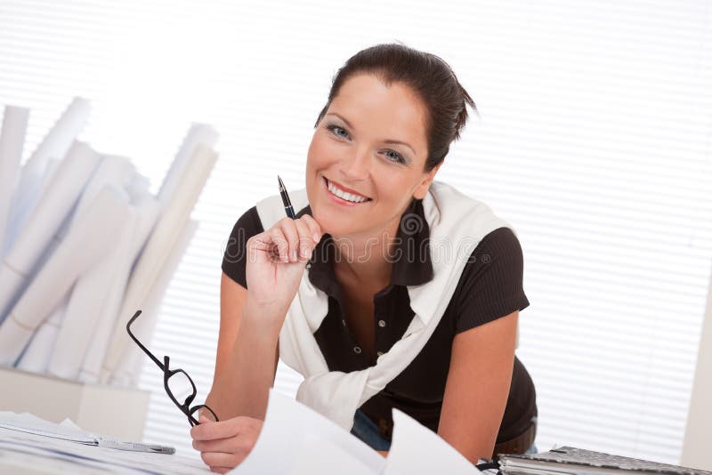 Young Female Architect with Plans at the Office Stock Photo - Image of ...