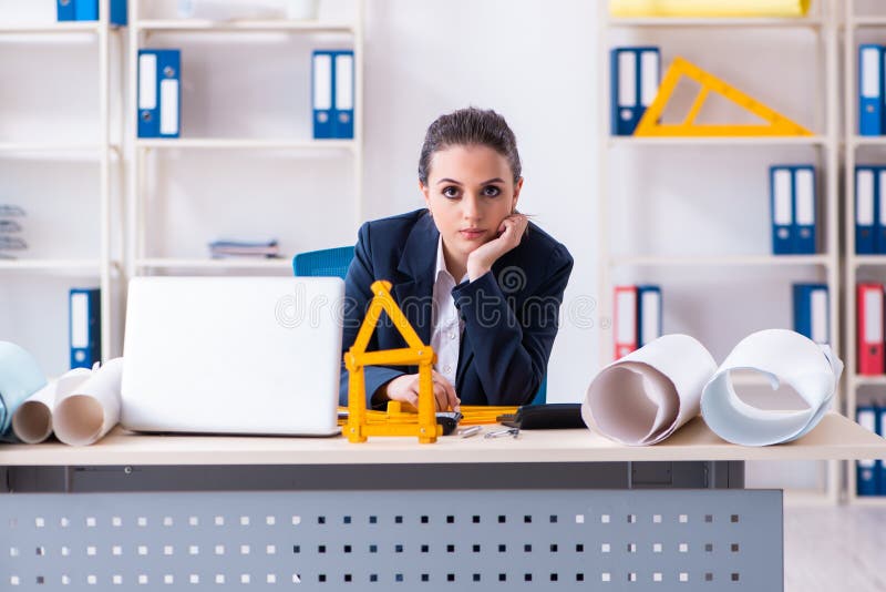 The Young Female Architect Working in the Office Stock Image - Image of ... The Young Female Architect Working in the Office Stock Image - Image of ...