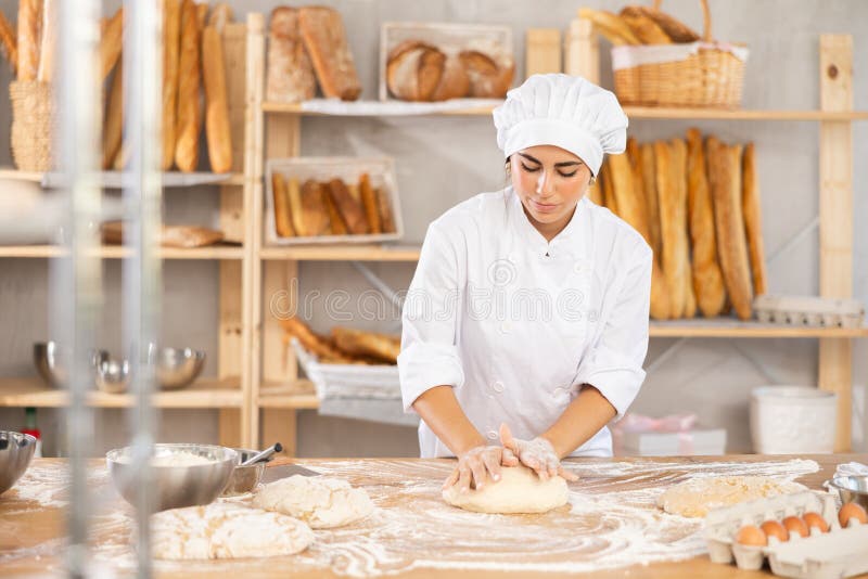 Young Female Baker Kneading Dough on Table Stock Image - Image of bread ...