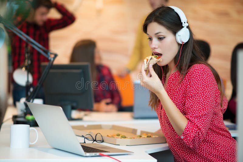 Young Female in Call Center Team Eating Pizza. Stock Photo - Image of ...