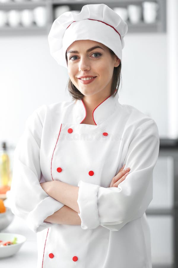 Young Female Chef in Kitchen Stock Photo - Image of arms, people: 151323112