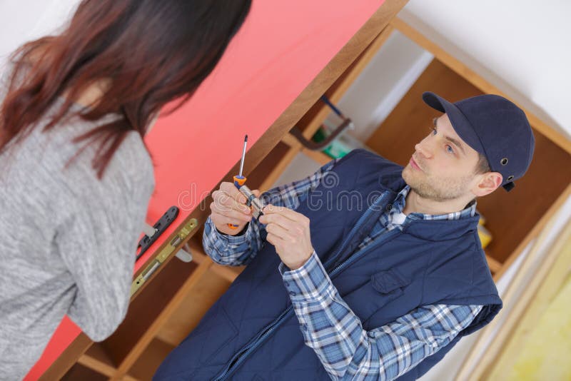 Young Female Client Talking with Locksmith Stock Photo - Image of ...