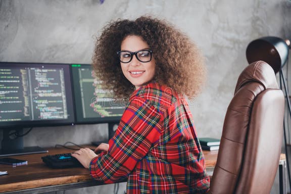 Smiling Young Programmer with Curly Hair Using Computer Screens in ...
