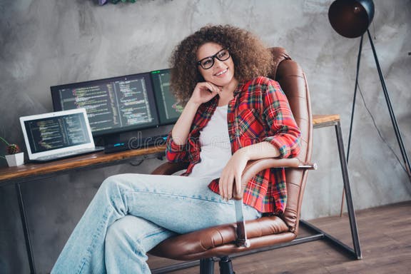 Young Female Coder Working Remotely with a Relaxed and Confident ...