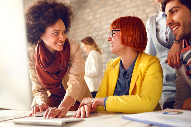 Female Colleagues Talking and Working at Computer Stock Photo - Image ...