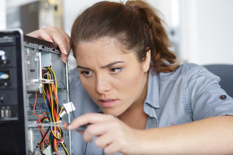 Young Female Computer Technician Repairing Tower Computer Stock Image ...