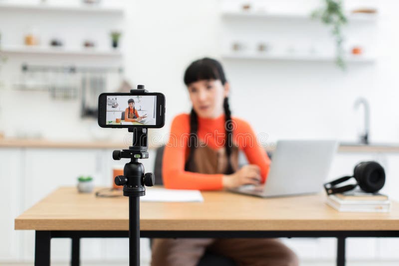 Young Female Content Creator Recording Video in Modern Kitchen Setup ...