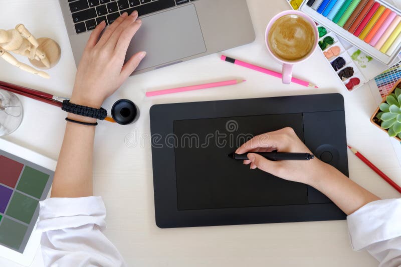 Graphic designer at work. stock image. Image of project - 112370209