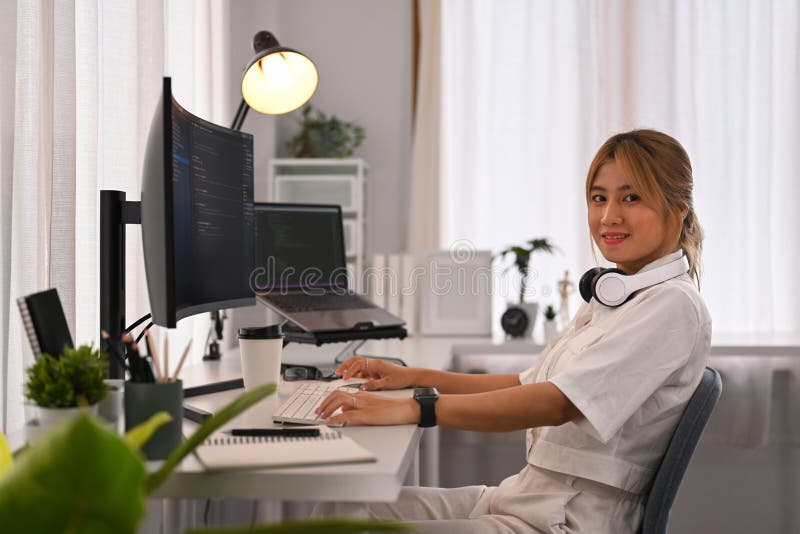 Young Female Developer Working With Coded Data On Computer Screen Developing Programming And