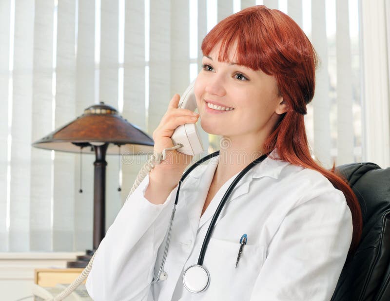 Young Female Doctor Calling on Phone Stock Image - Image of friendly ...