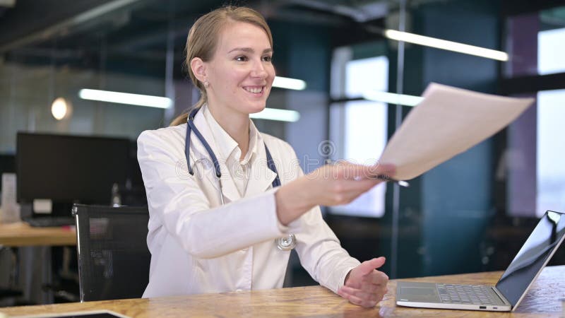 Young Female Doctor Giving Documents, Medical Report Stock Photo ... Young Female Doctor Giving Documents, Medical Report Stock Photo ...