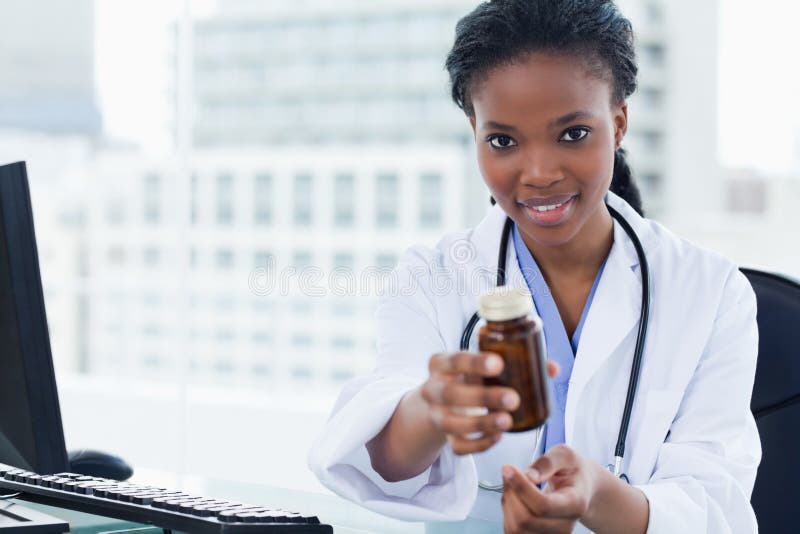 Young Female Doctor Giving Medication Stock Image - Image of cheerful ...