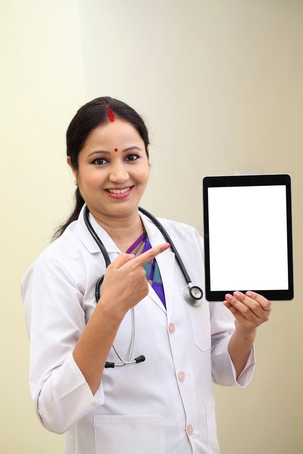 Young Female Doctor Holding Tablet Computer Stock Photo - Image of ...