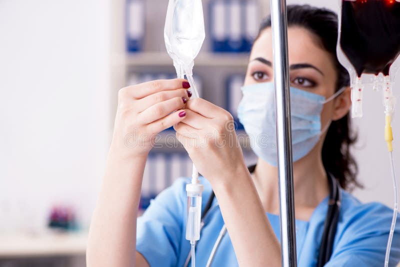 Young Female Doctor in Infusion Concept Stock Photo - Image of checking ...