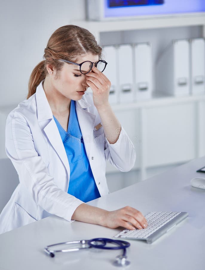 Young Female Doctor Tired after Working with Computer Stock Image ...