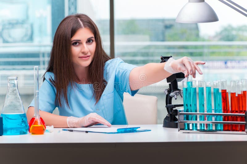 The Young Female Doctor Working in the Lab Stock Image - Image of ...