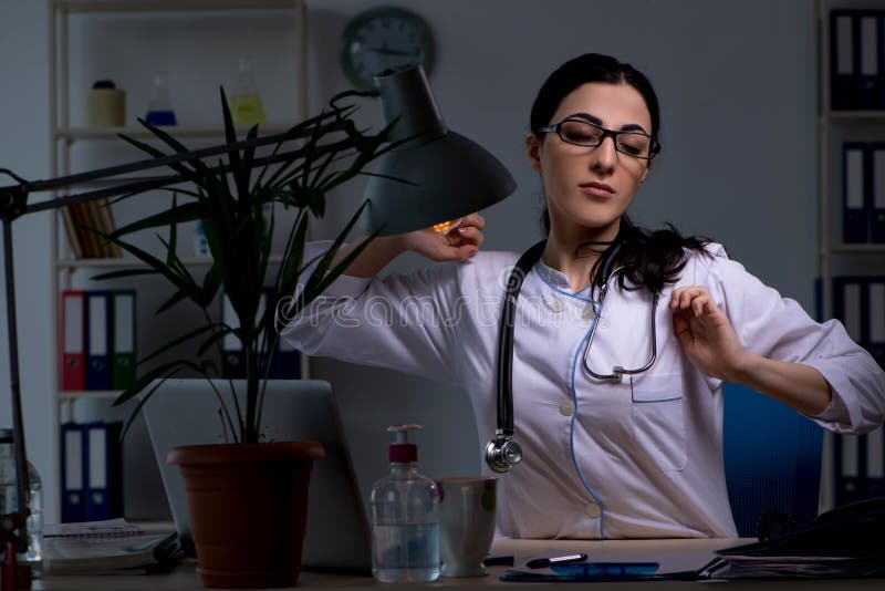 The Young Female Doctor Working at Night Shift Stock Image - Image of ...