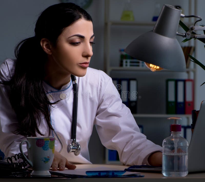 Young Female Doctor Working at Night Shift Stock Photo - Image of ...
