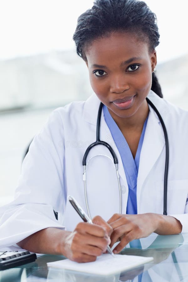 A Young Female Doctor Writing a Prescription Stock Image - Image of ...