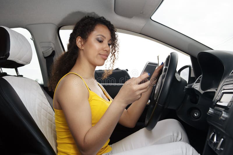 Young Female Driver Using Touch Screen Smartphone and Gps Navigation in ...