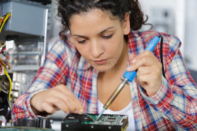 Young Female Electronic Engineer Soldering Computer Parts Stock Image ...