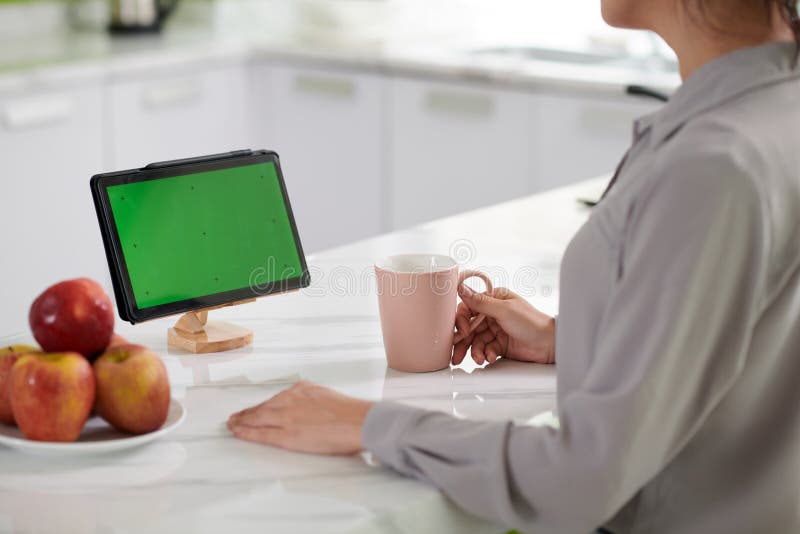 Young Female Employee with Cup of Coffee Sitting by Table in Front of ...