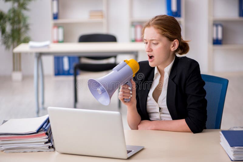 Young Female Employee Holding Megaphone in the Office Stock Photo ...