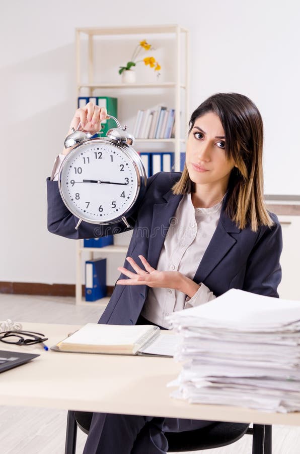 The Young Female Employee in Time Management Concept Stock Image ...