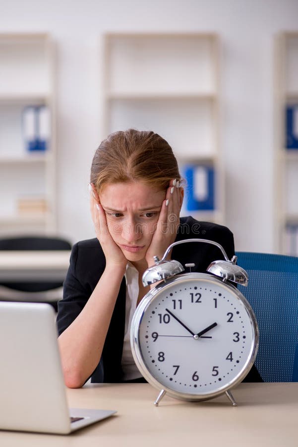 Young Female Employee in Time Management Concept Stock Photo - Image of ...