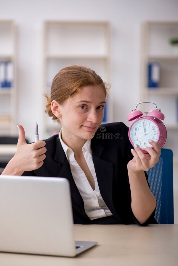 Young Female Employee in Time Management Concept Stock Photo - Image of ...